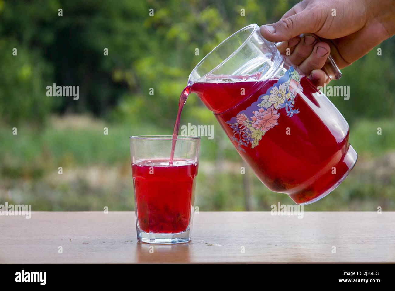 Closeup pouring juice glass hi-res stock photography and images - Alamy