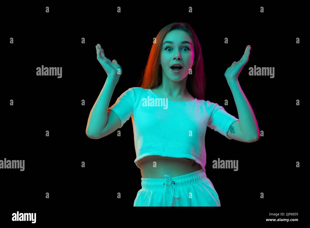 Portrait of young beautiful girl, showing positive excitement and shock ...