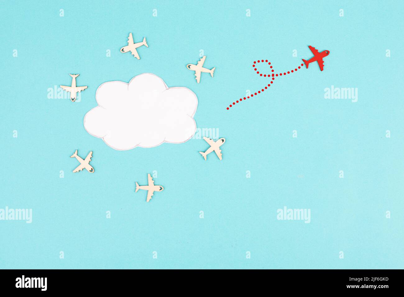 Group of airplanes flying in a circle around a cloud, red plane thinks ...