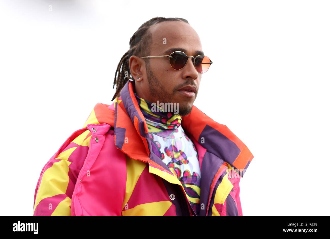 Mercedes' Lewis Hamilton arrives at the paddock ahead of the British ...