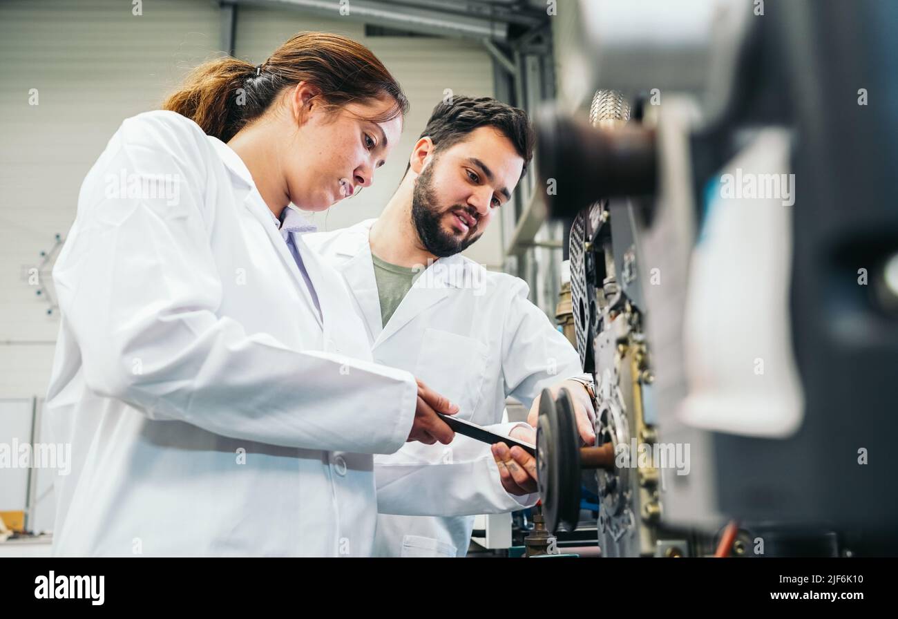 Man woman in laboratory robes hi-res stock photography and images - Alamy