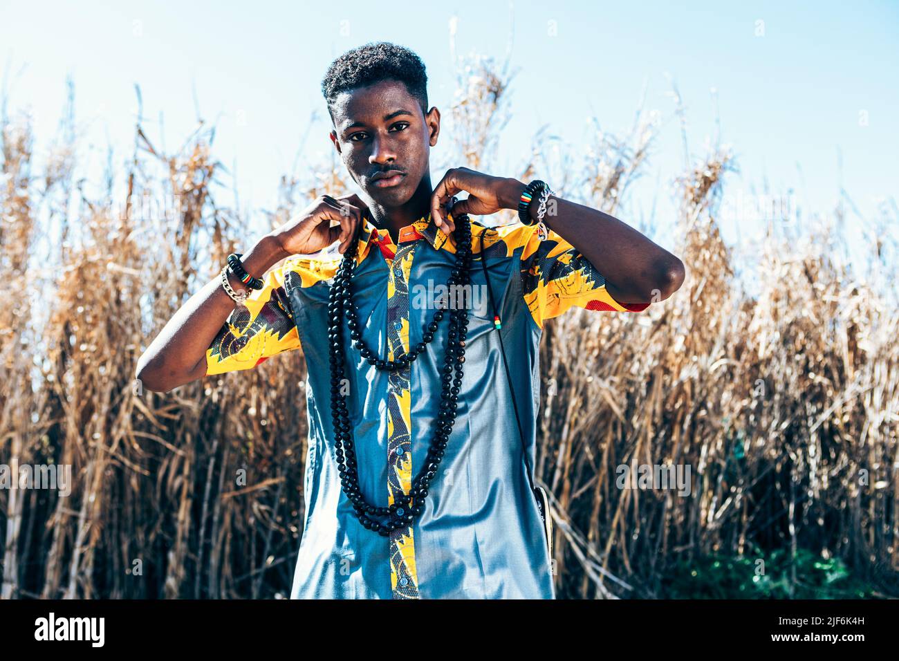 Front view of serious ethnic man wearing native African clothing and ...