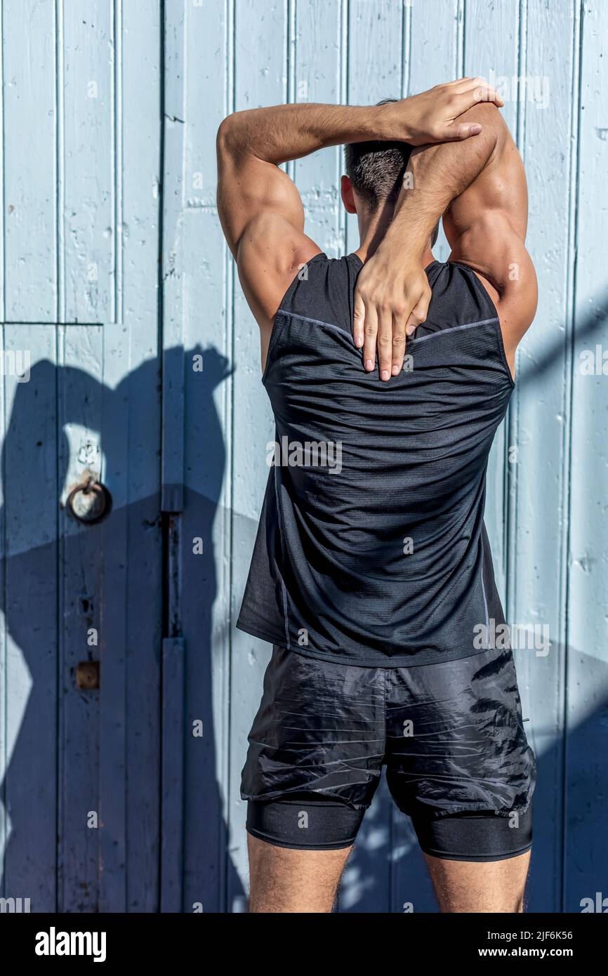 Man stretching against wall hi-res stock photography and images - Alamy