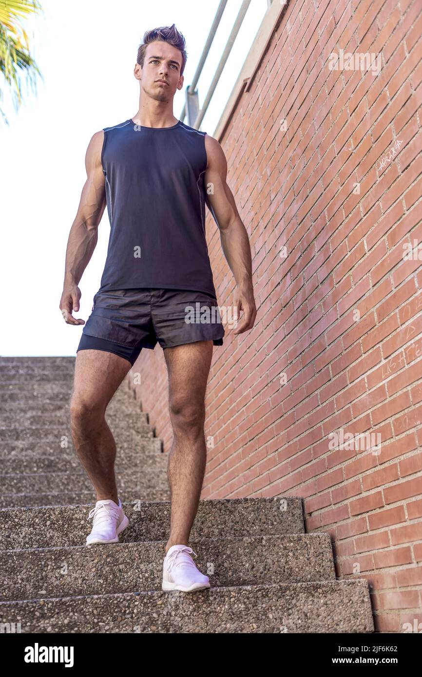 Athlete walking down the stairs of a stadium stand Stock Photo - Alamy