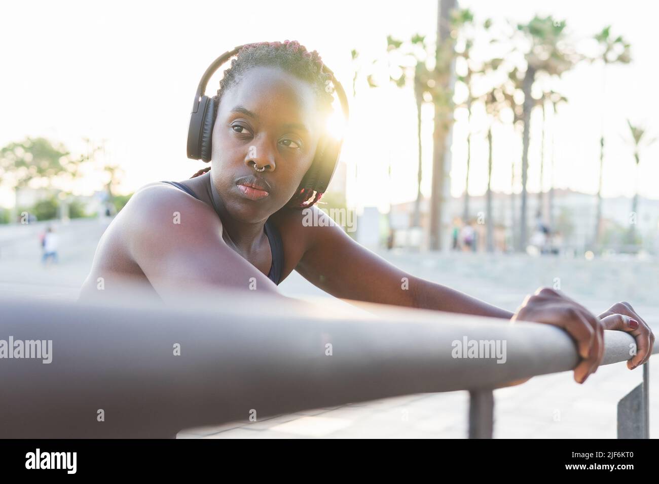 Male employee putting white face mask for work in garage Stock Photo ...