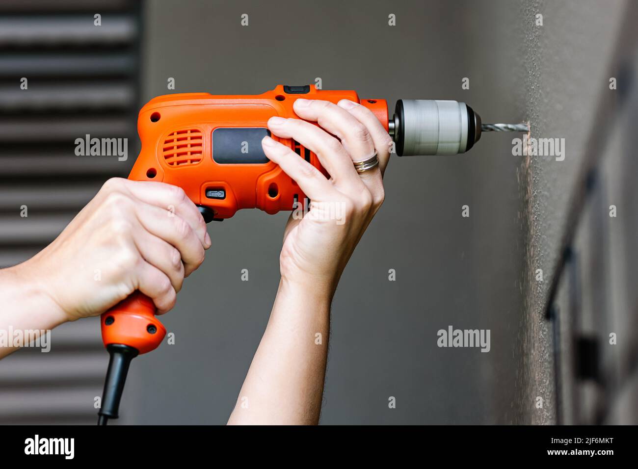 Full body side view of sportive female lying on mat with leg on tree ...