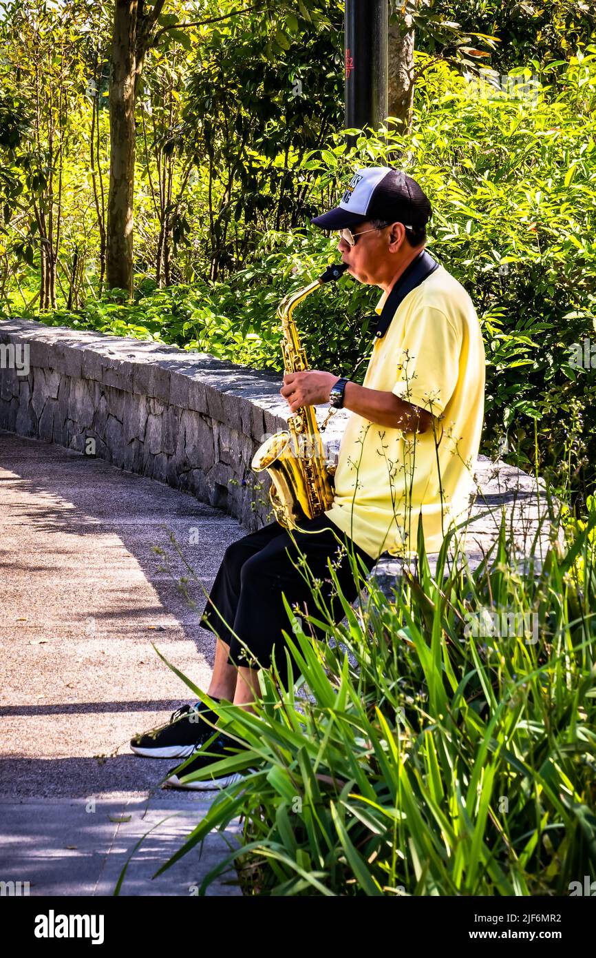 Musician playing Saxophone at Rower’s Bay Park. It features a boardwalk ...