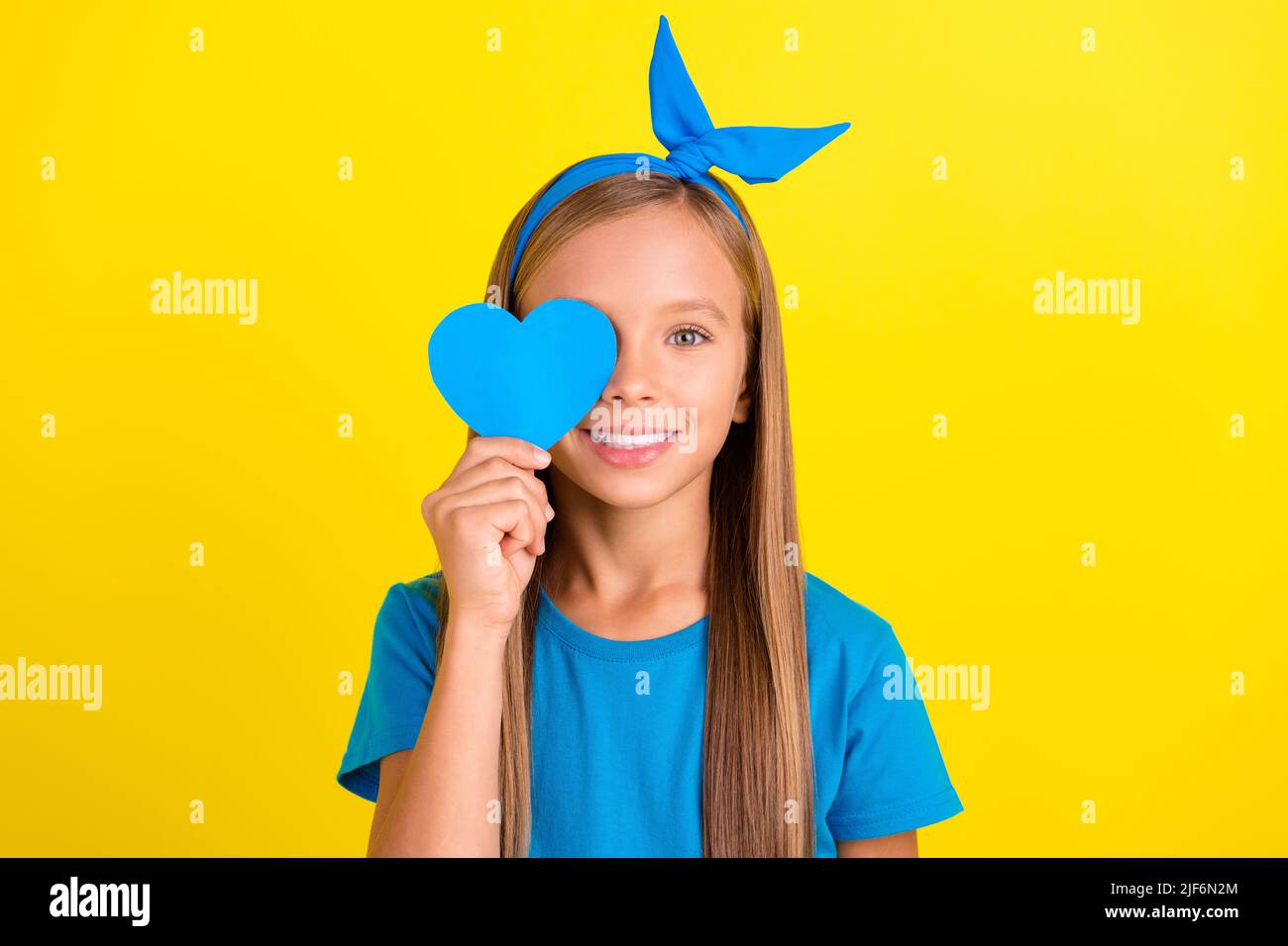 Portrait of funny cheerful person arm hold paper heart card cover one ...