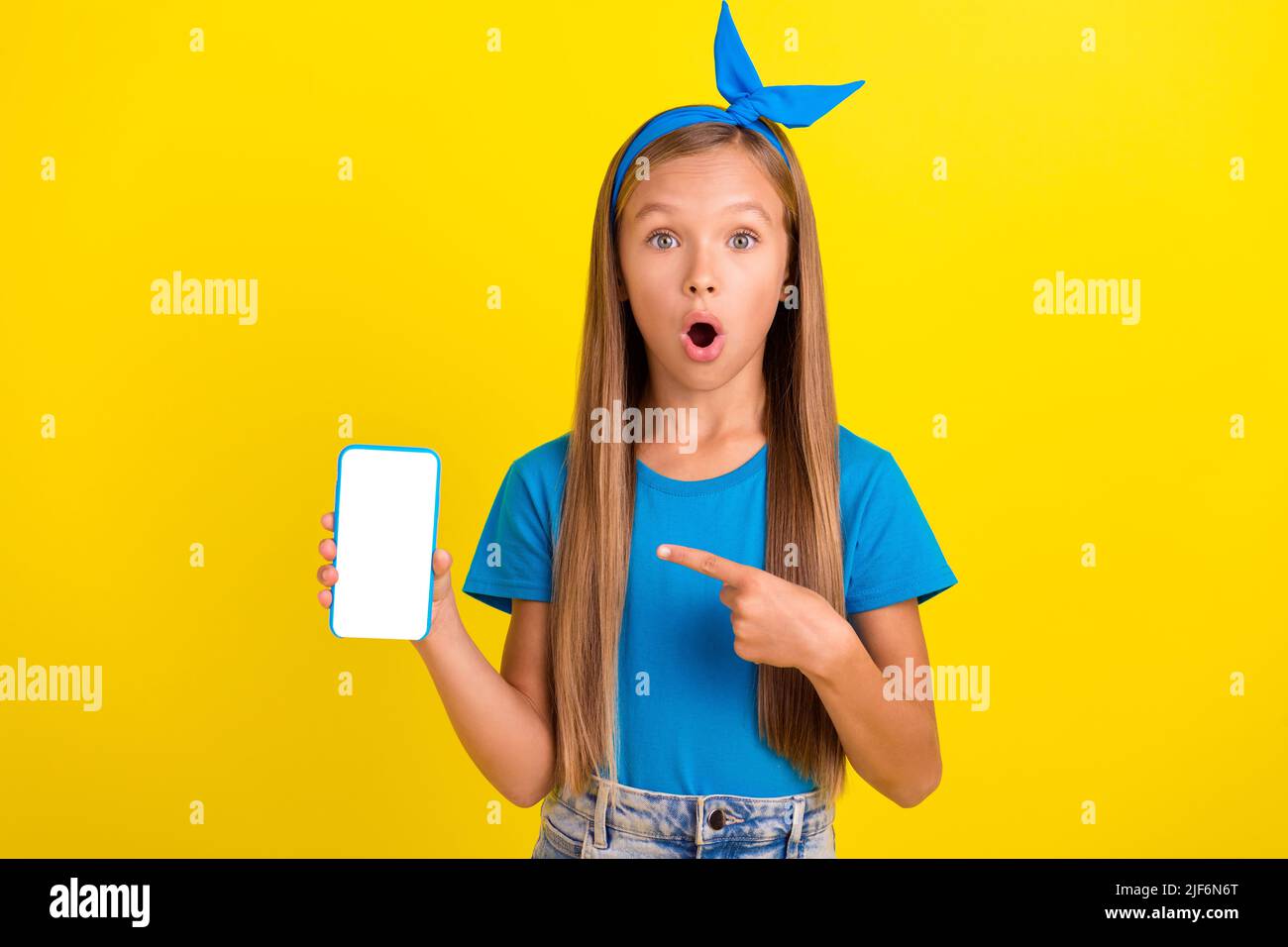 Portrait of shocked impressed girl indicate finger arm hold demonstrate ...