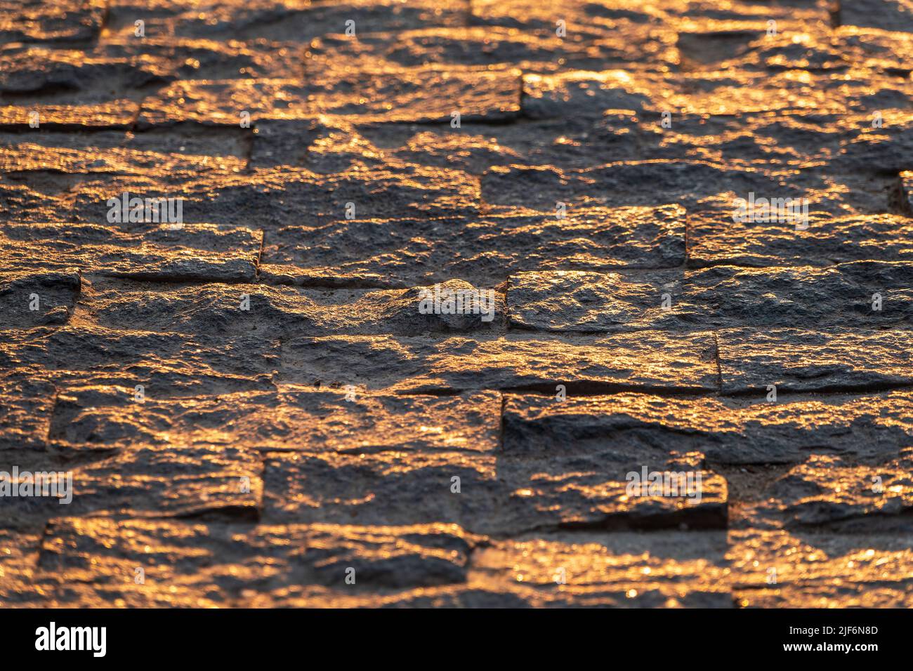 Stone pavement in the rays of the setting sun. Backround of Block ...
