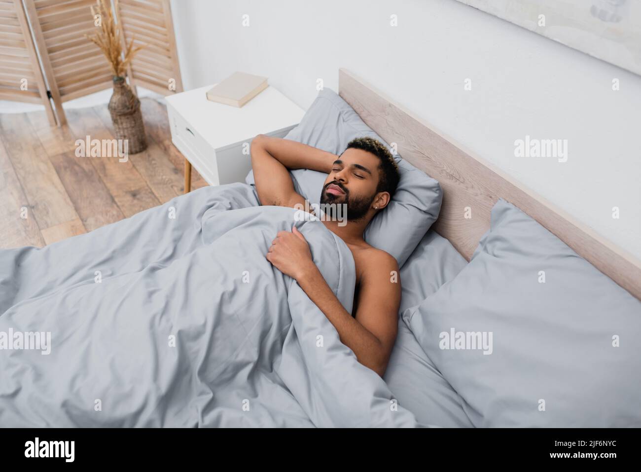 high angle view of young african american man sleeping in bed Stock ...