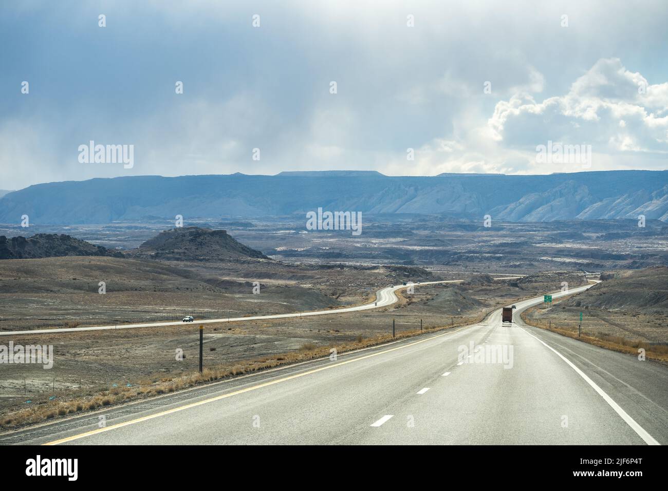 Breathtaking scenery of butte rocky outcrop formations with cloudy sky ...