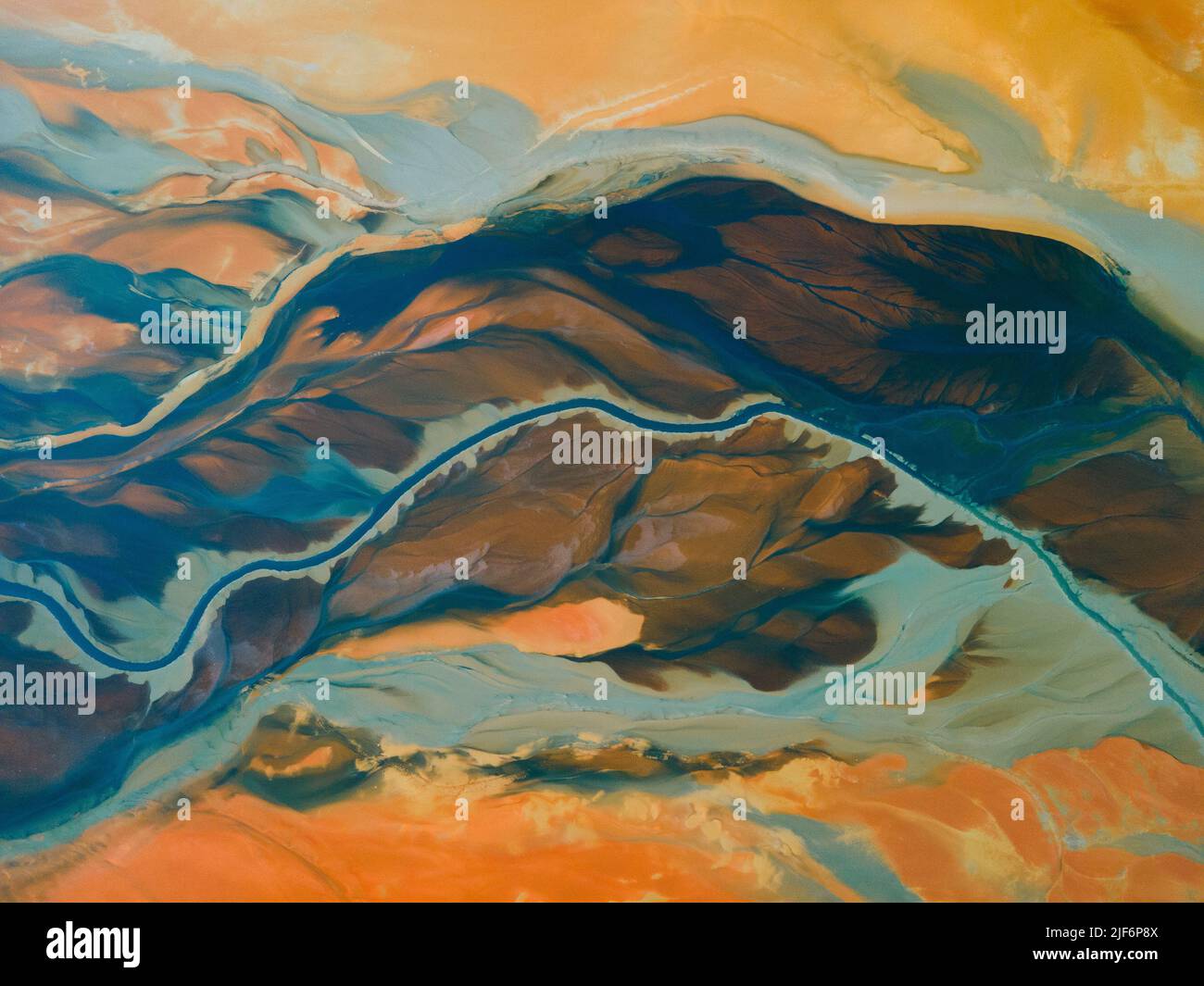 Top view of abstract textured background with colorful yellow and blue ...