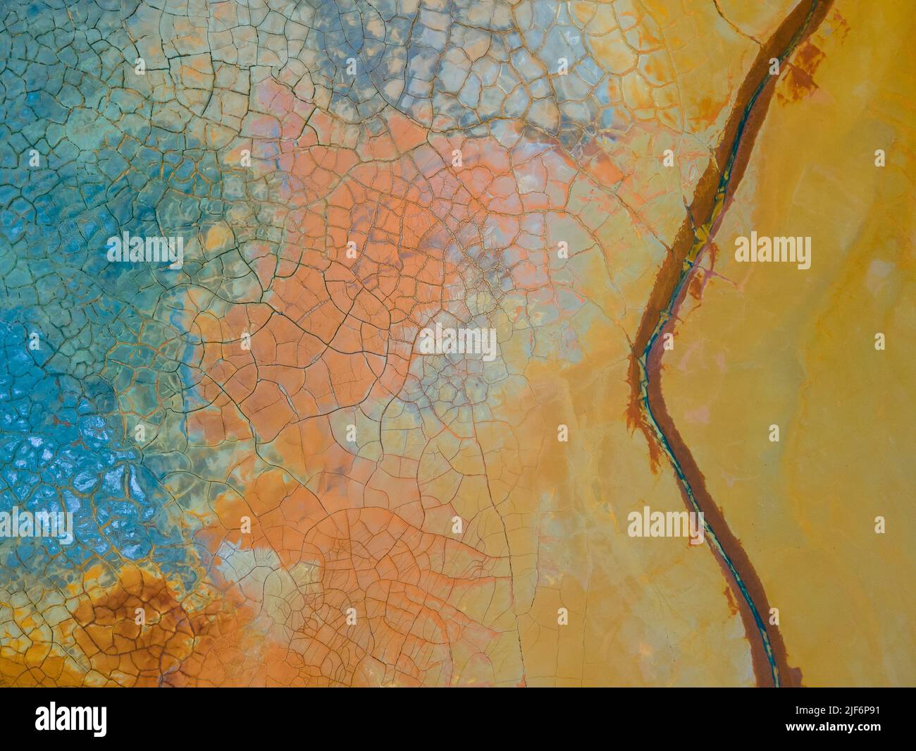 Top view of abstract textured background with colorful yellow and blue ...