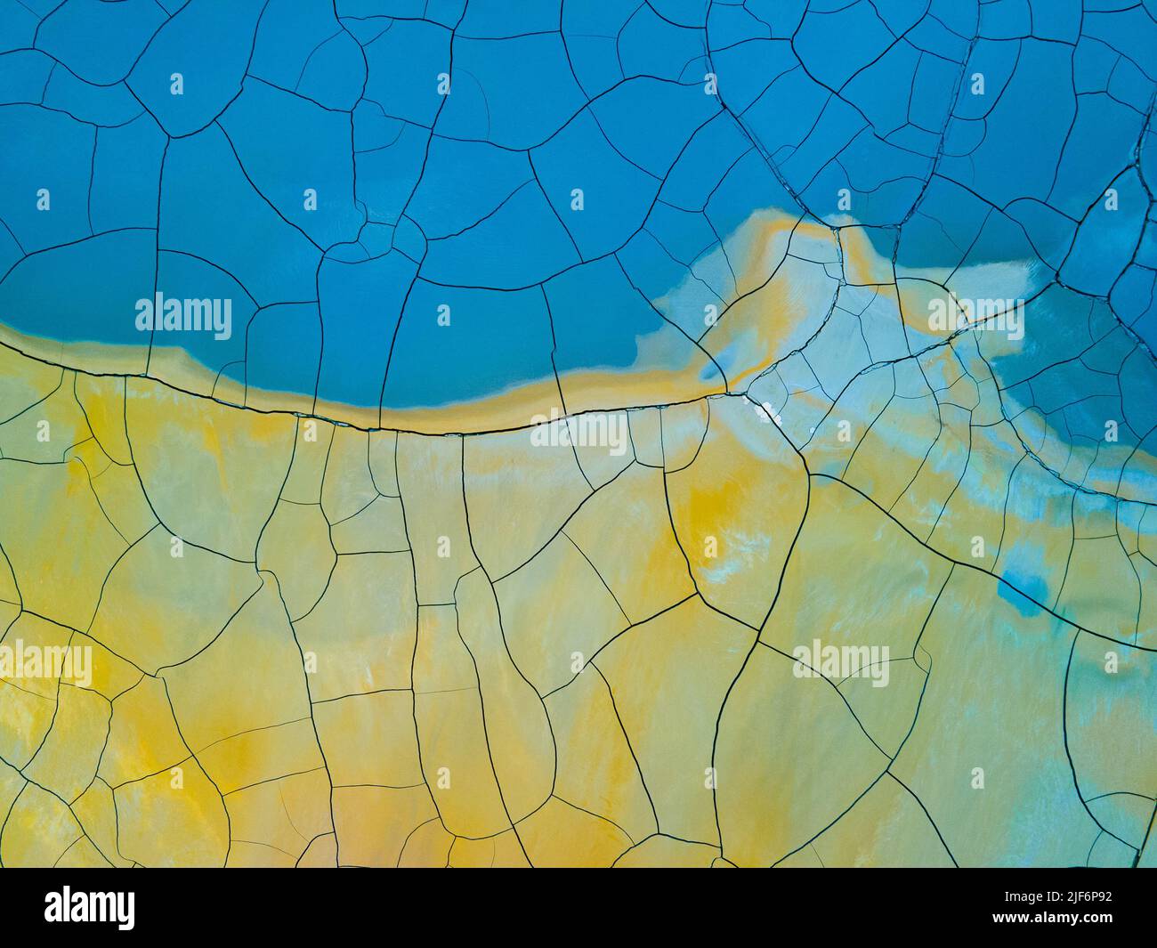 Top view of abstract textured background with colorful yellow and blue ...