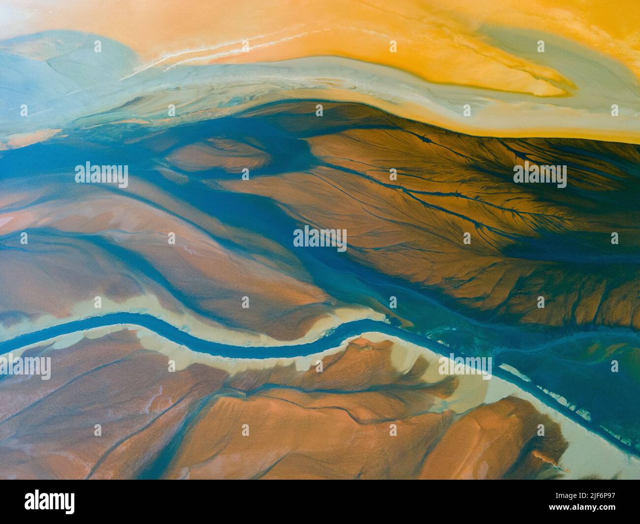 Top view of abstract textured background with colorful yellow and blue ...