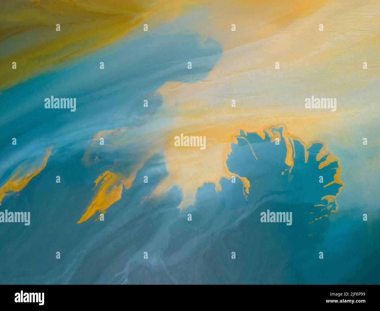 Top view of abstract textured background with colorful yellow and blue ...