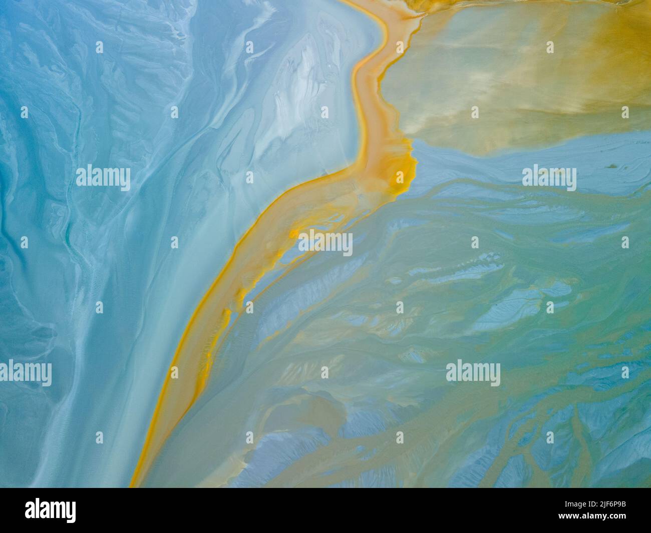 Top view of abstract textured background with colorful yellow and blue ...