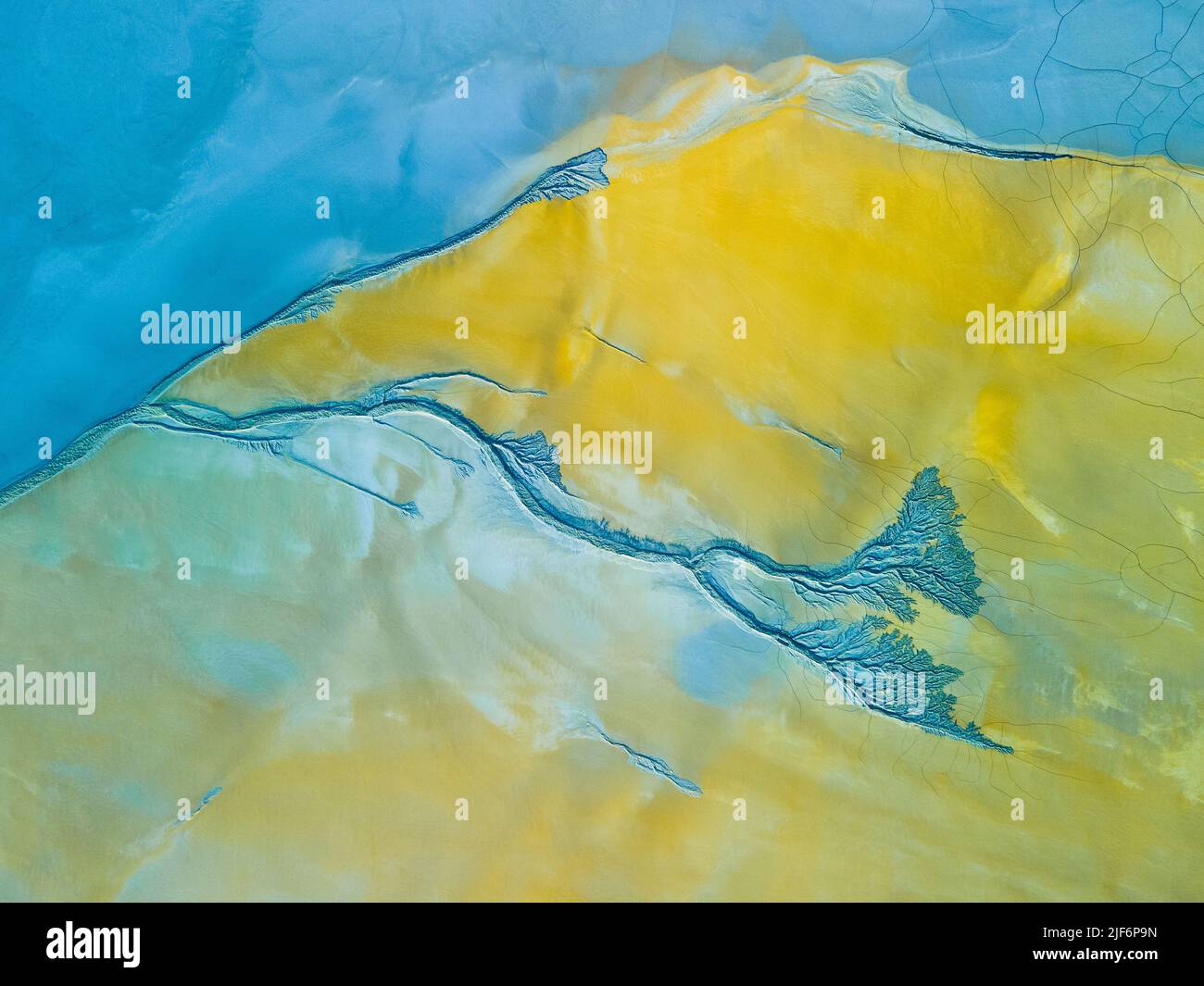 Top view of abstract textured background with colorful yellow and blue ...