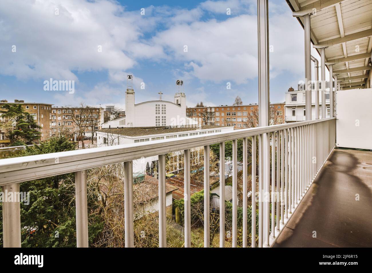 Narrow brick balcony with metal railings and door Stock Photo - Alamy