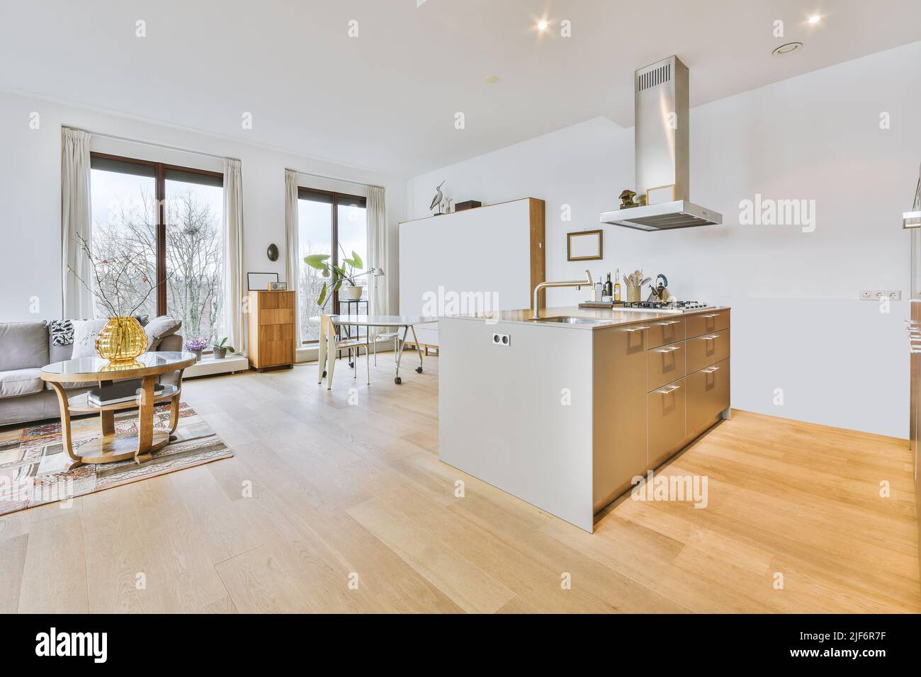 Interior of contemporary kitchen with gray counters and appliances in ...