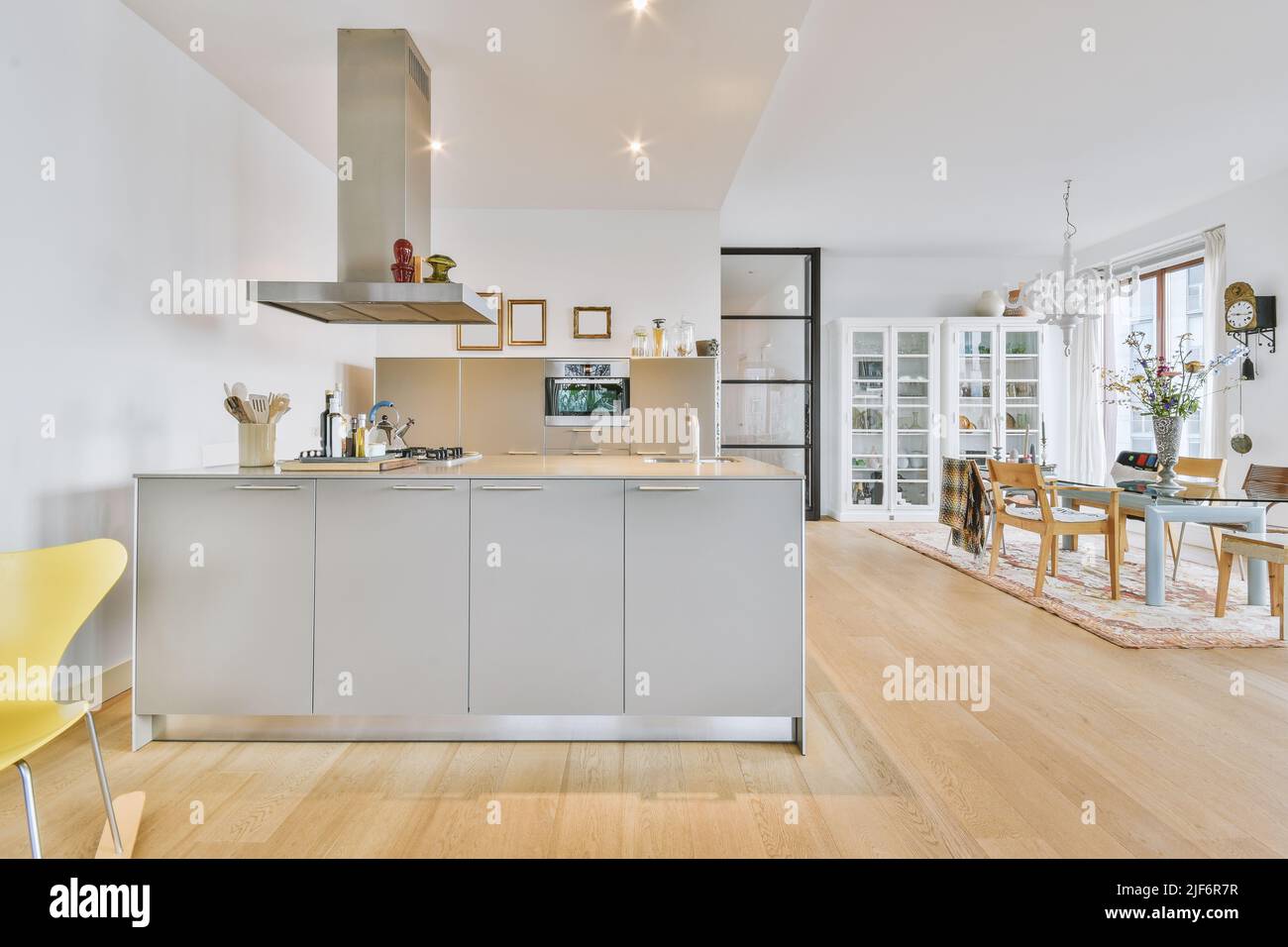 Interior of contemporary kitchen with gray counters and appliances in ...