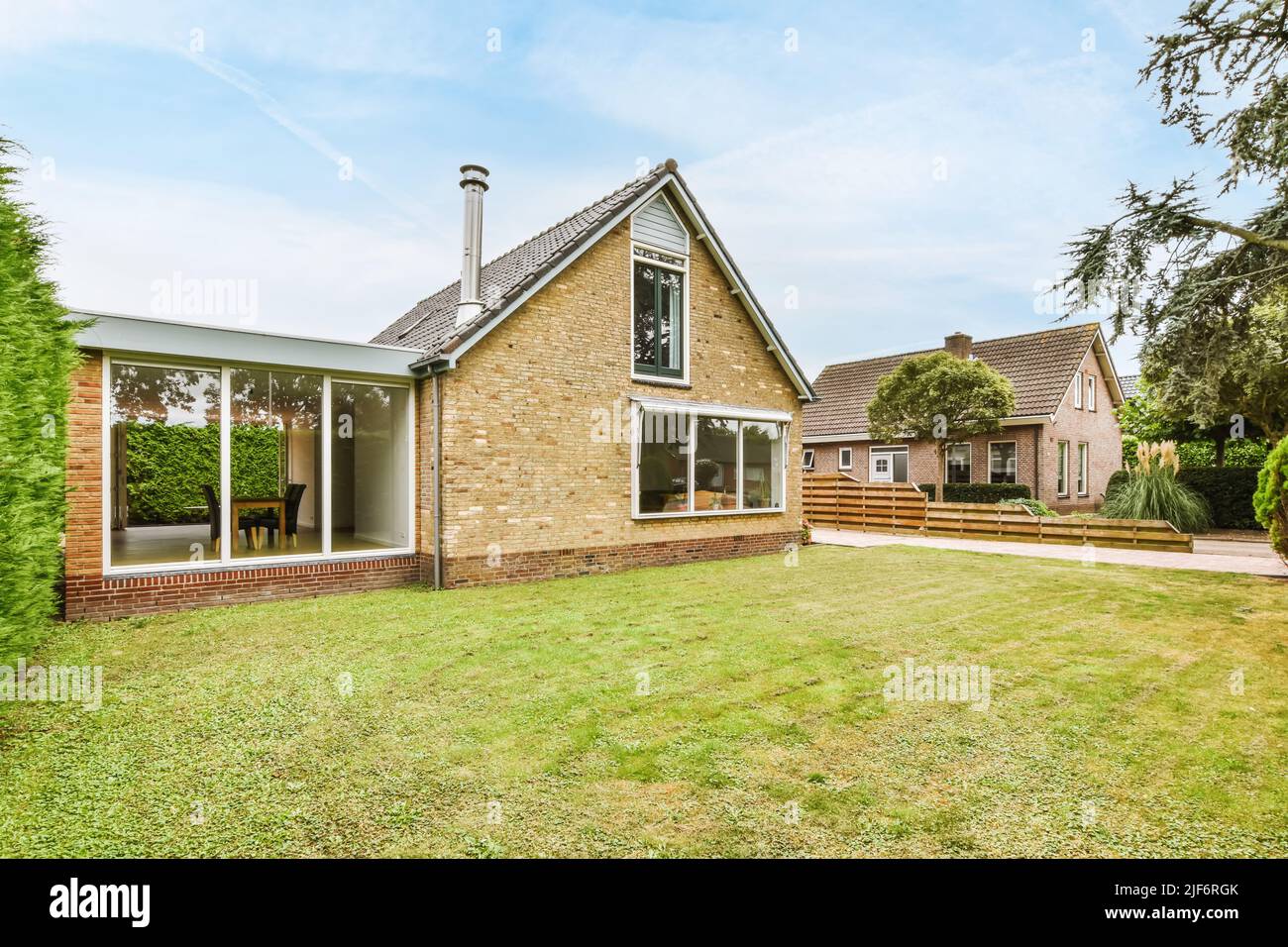 Patio of residential building terrace with grassy lawn in countryside ...