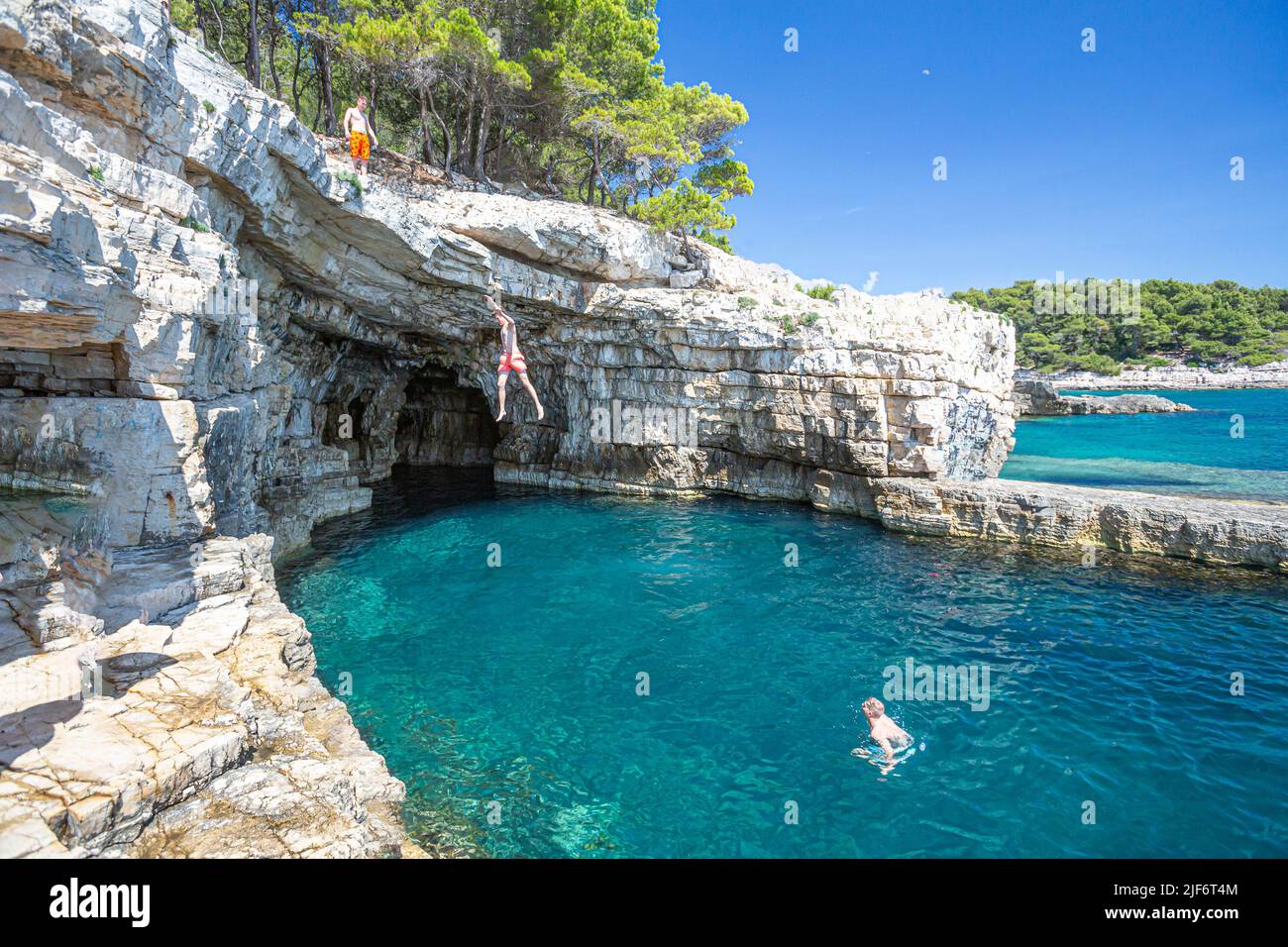 Croatia, Istria, Pula, coastline with rocks and cave Stock Photo - Alamy