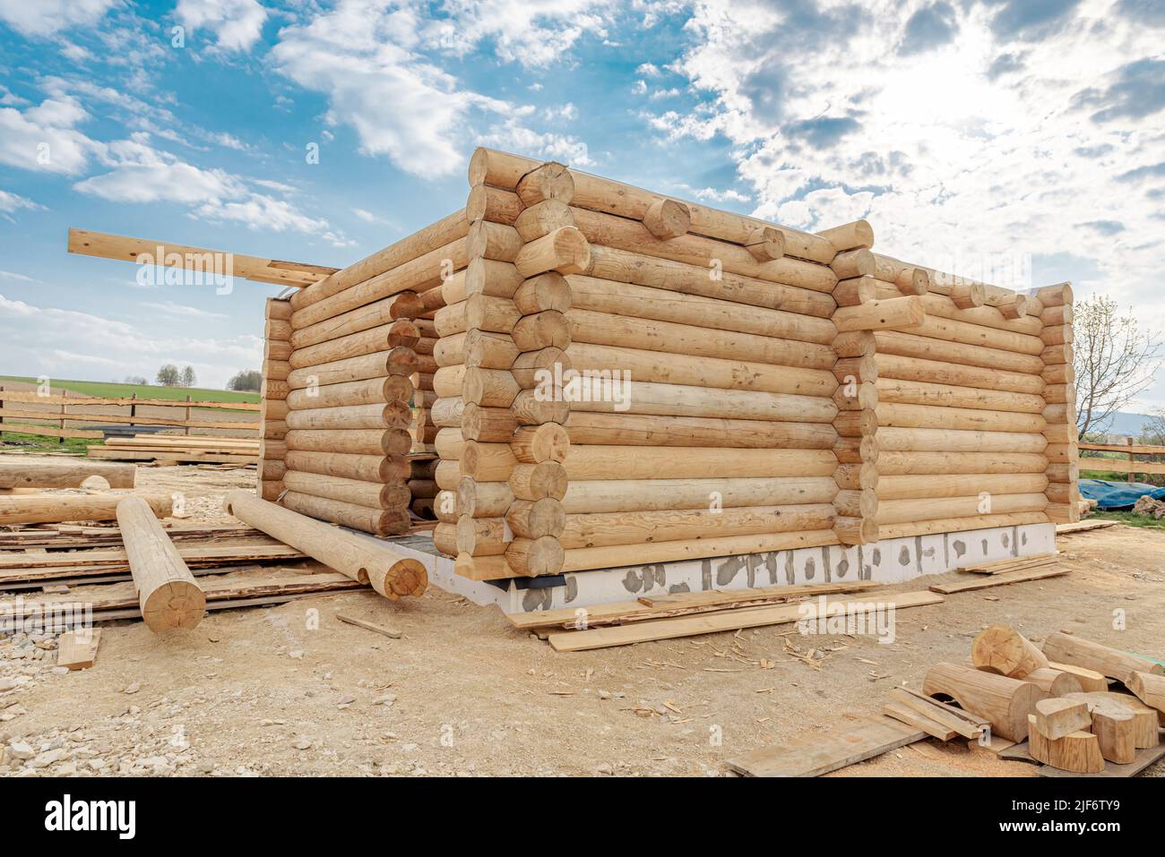 Construction site of wooden mountain house. Traditional log cabin built ...