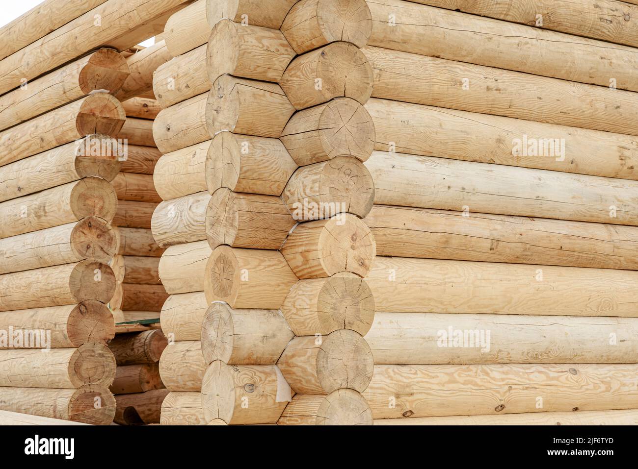 Facade wall of wooden mountain house. Traditional log cabin built from ...