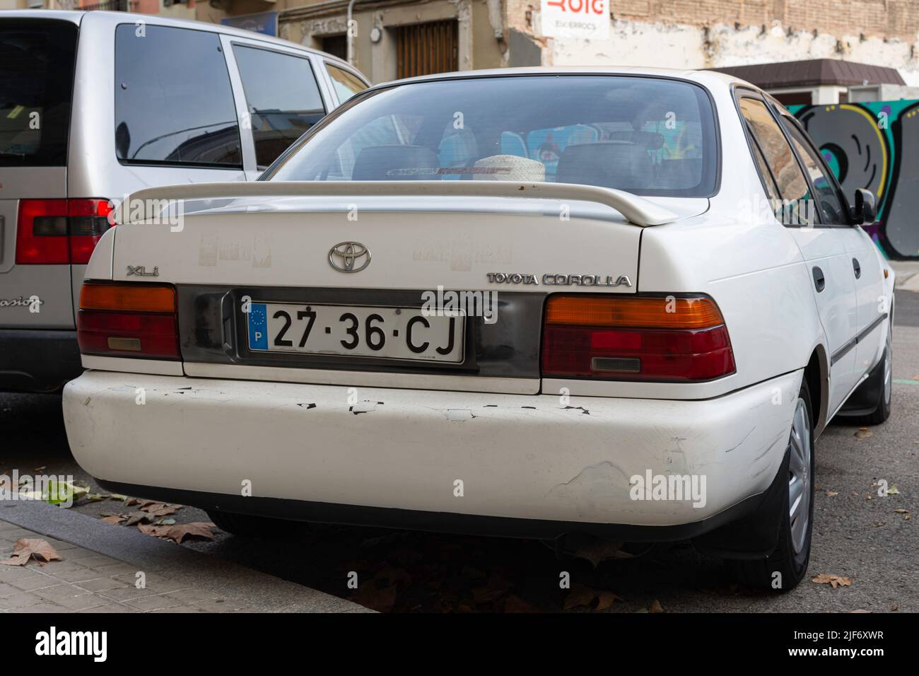 Typical European car parked on the street. Toyota Corolla white Stock ...