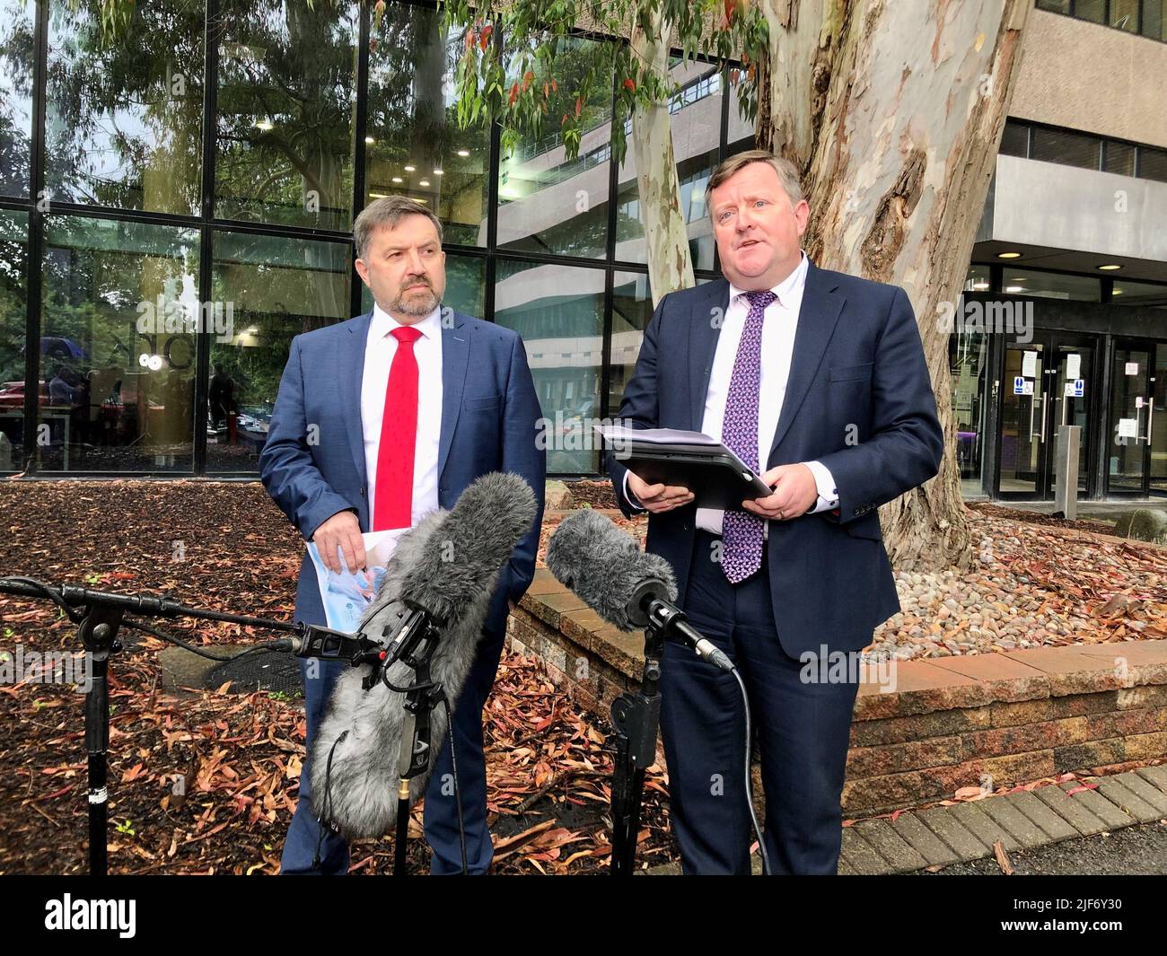 Health Minister Robin Swann and Professor Mark Taylor outside ...