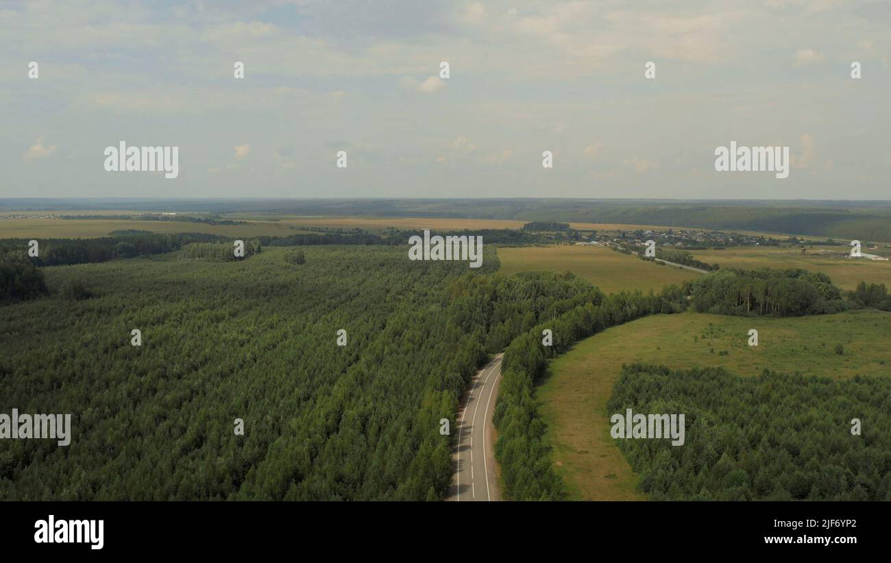 Asphalt road between forest and rural fields in Ural, Russia. Beautiful ...
