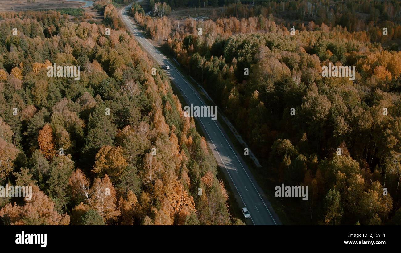 Asphalt road with traffic cars between forest in Ural, Russia ...