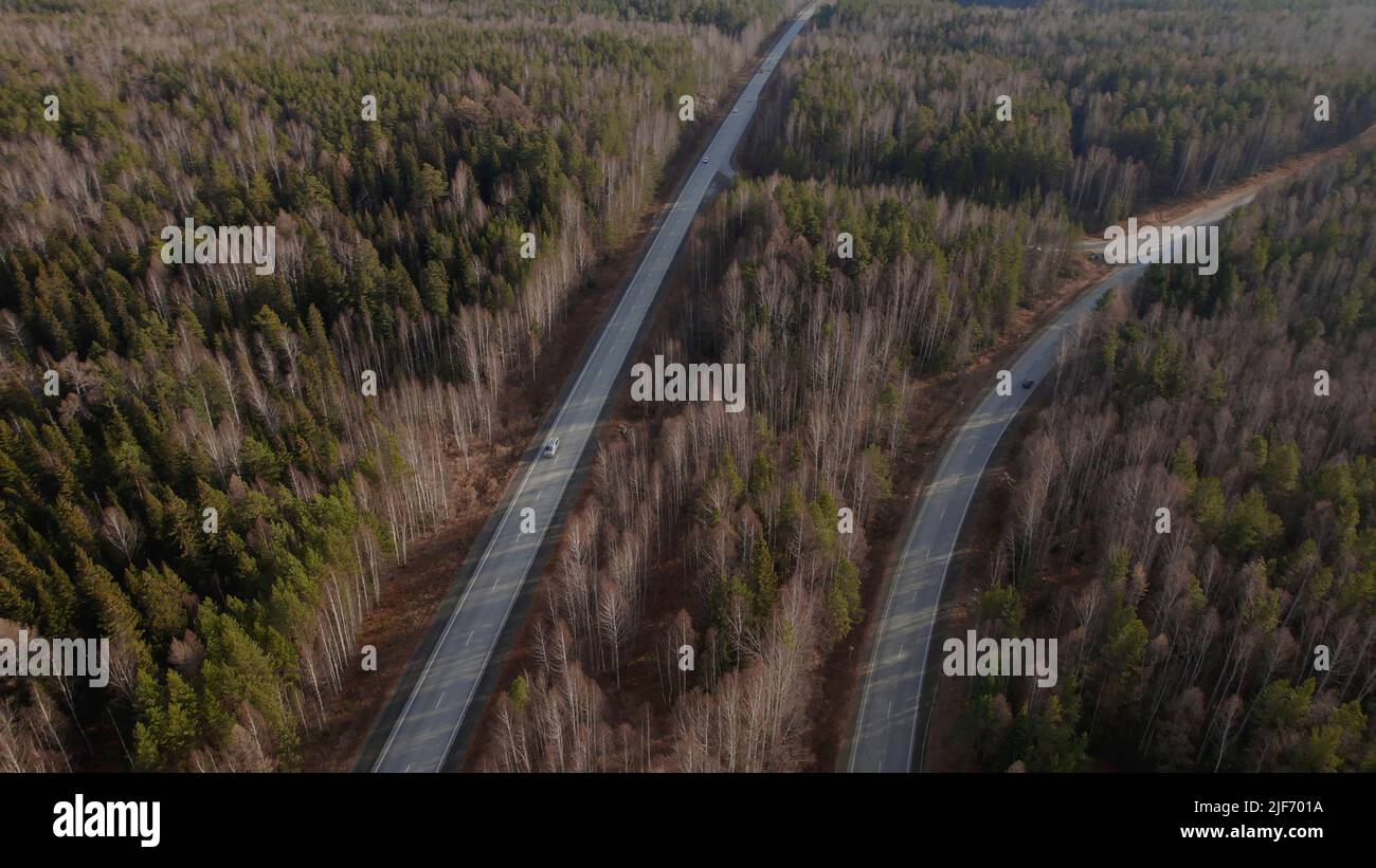 Curve of highway road between deep forest in Ural, Russia. Beautiful ...