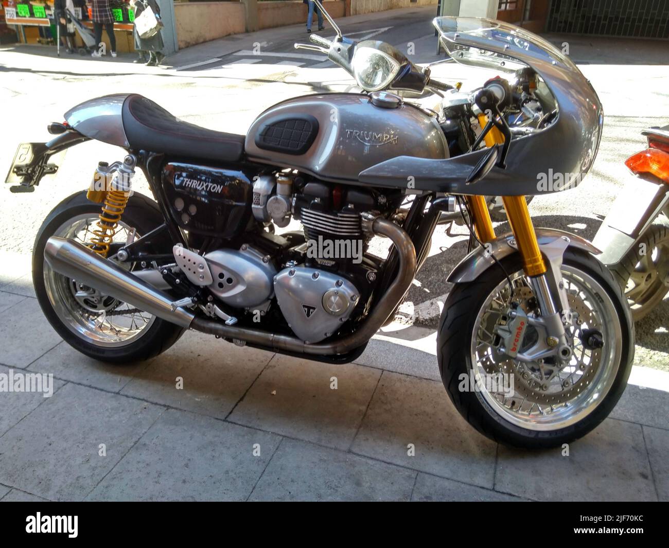 Classic restored motor bike in the street. Triumph Thruxton Stock Photo ...