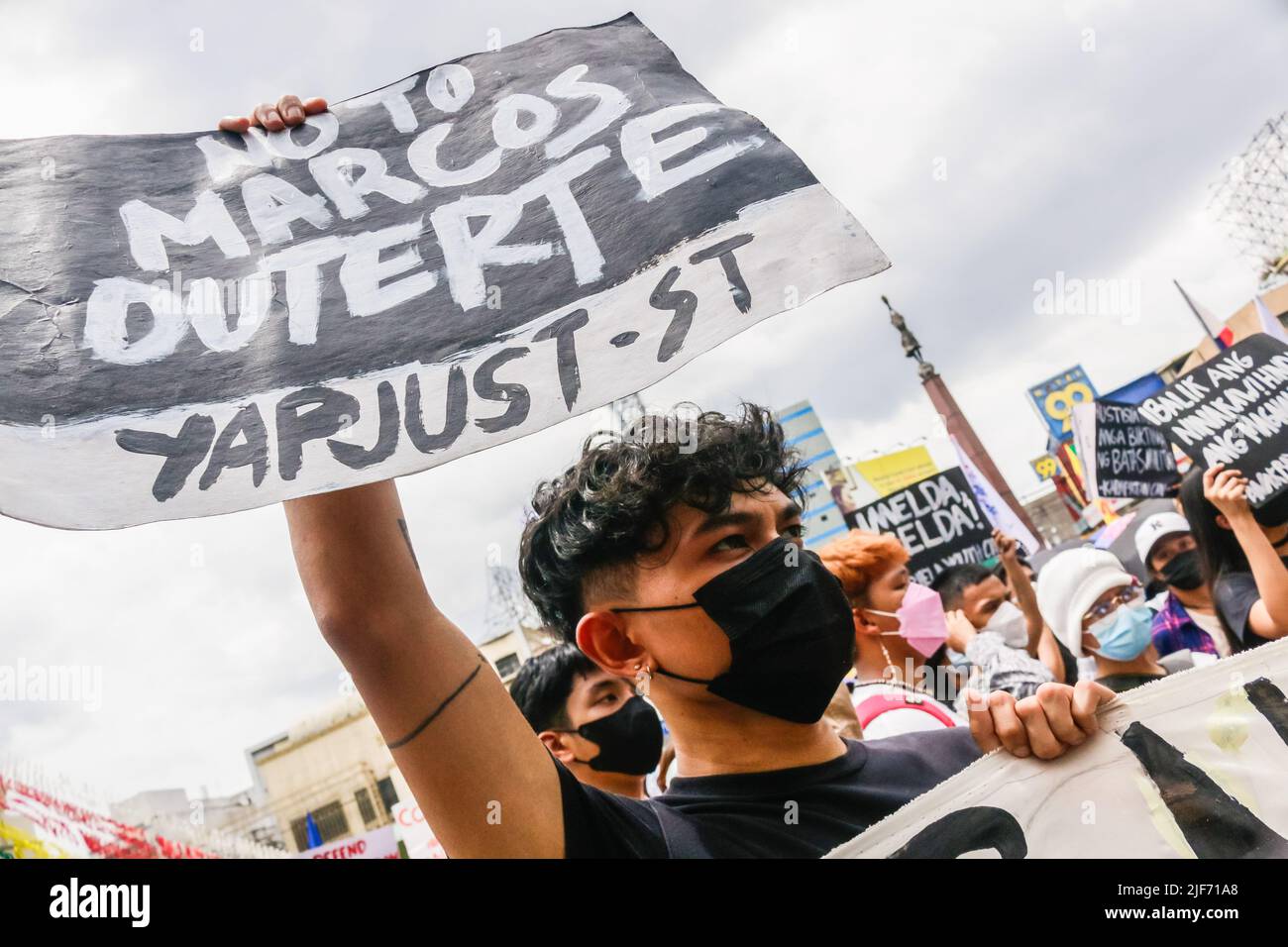 A protester holds a placard during a demonstration at the inauguration ...