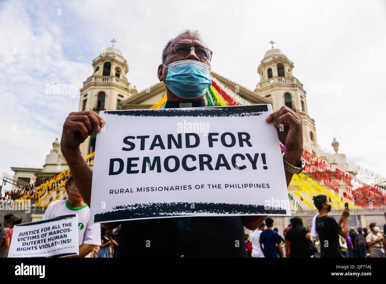Manila, Philippines. 30th June, 2022. A protester holds a placard ...