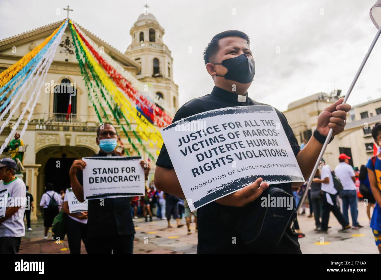 Manila, Philippines. 30th June, 2022. Protesters hold placards during a ...