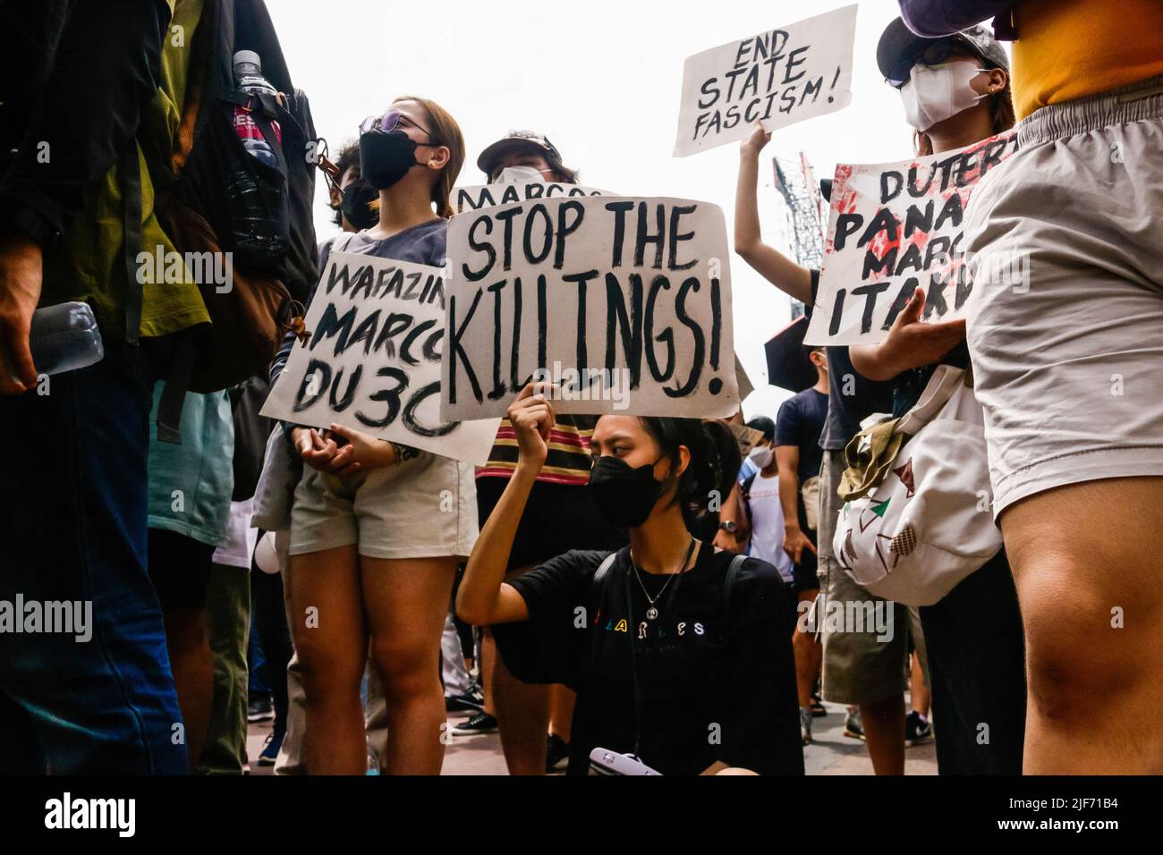 Manila, Philippines. 30th June, 2022. Protesters hold placards during a ...