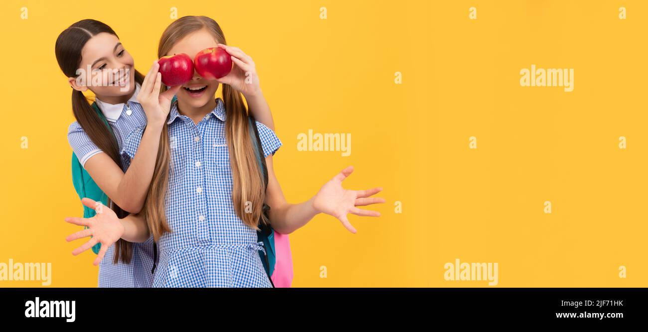 Fruit for the fruity face. Happy friends have fun with apples. Fruit ...