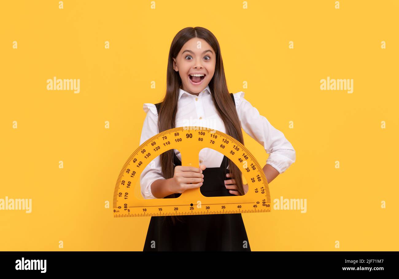 mathematics. surprised teen girl hold protractor ruler. back to school ...