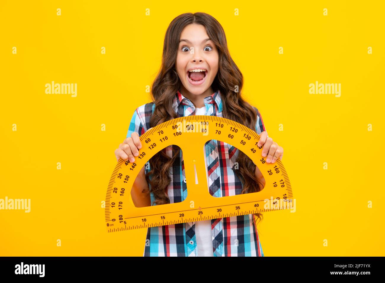 Amazed teen girl. Teenager child school girl holding measure for ...