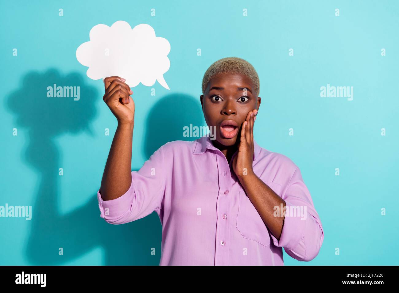 Photo of impressed confused girl arm touch cheek open mouth look camera ...