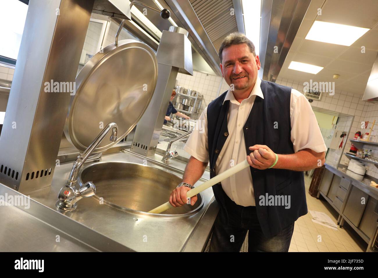 Schierke, Germany. 30th June, 2022. Brockenwirt Daniel Steinhoff stands in the kitchen of his ...