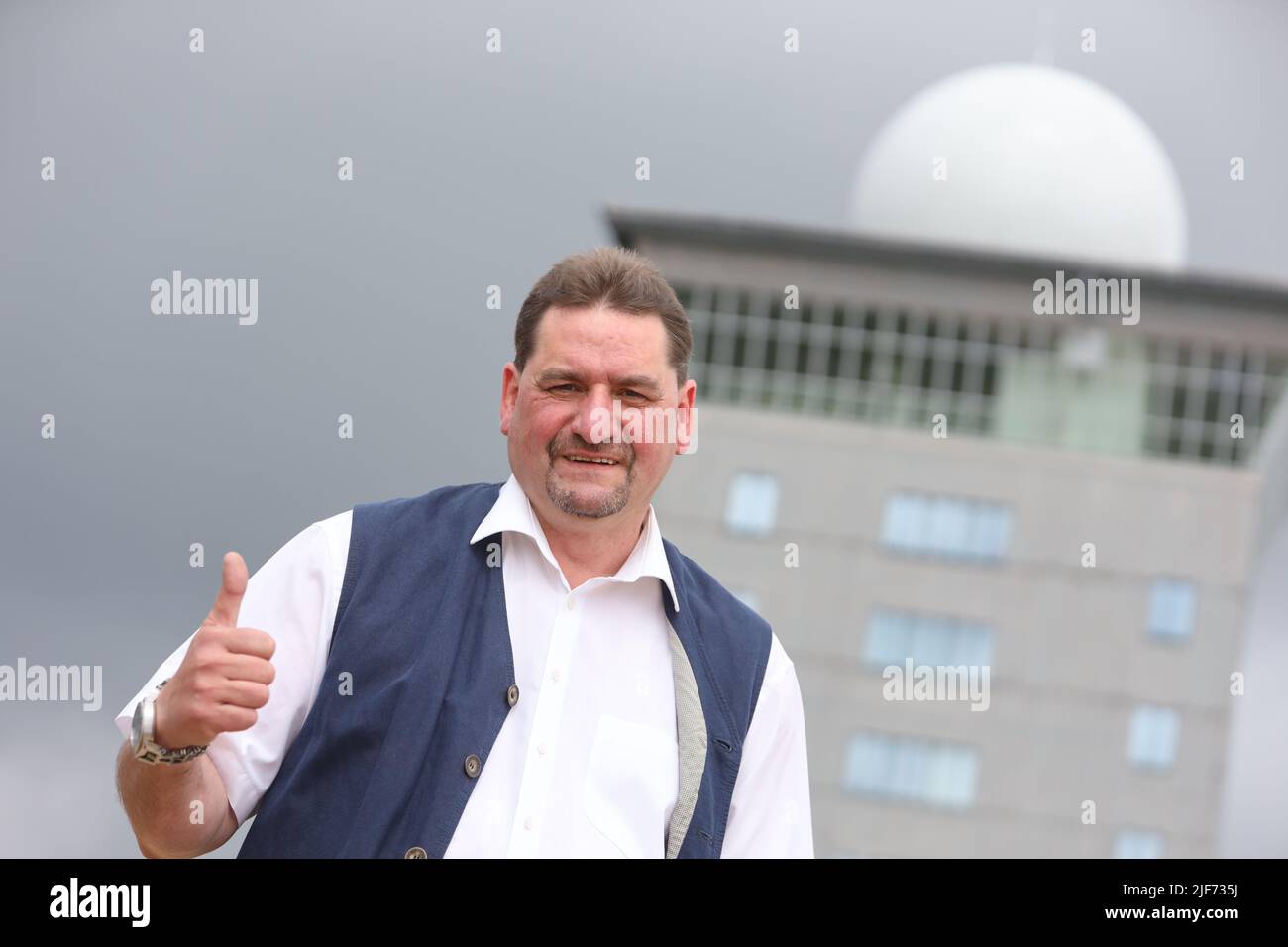 Schierke, Germany. 30th June, 2022. Brocken host Daniel Steinhoff stands on the Brocken in front ...