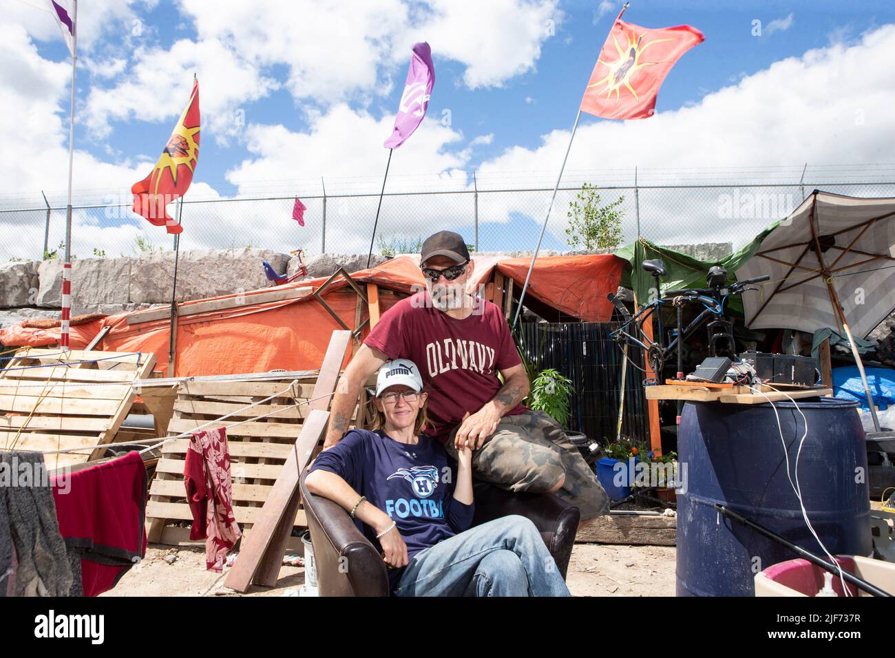 Will House and Jen Draper are photographed outside their home at a ...