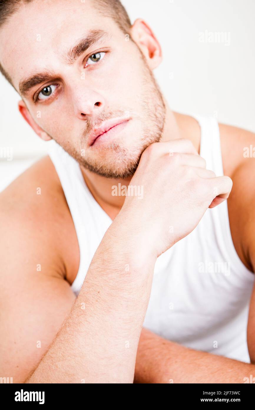 Vested Portrait. A confident look on the face of an athletic male model ...
