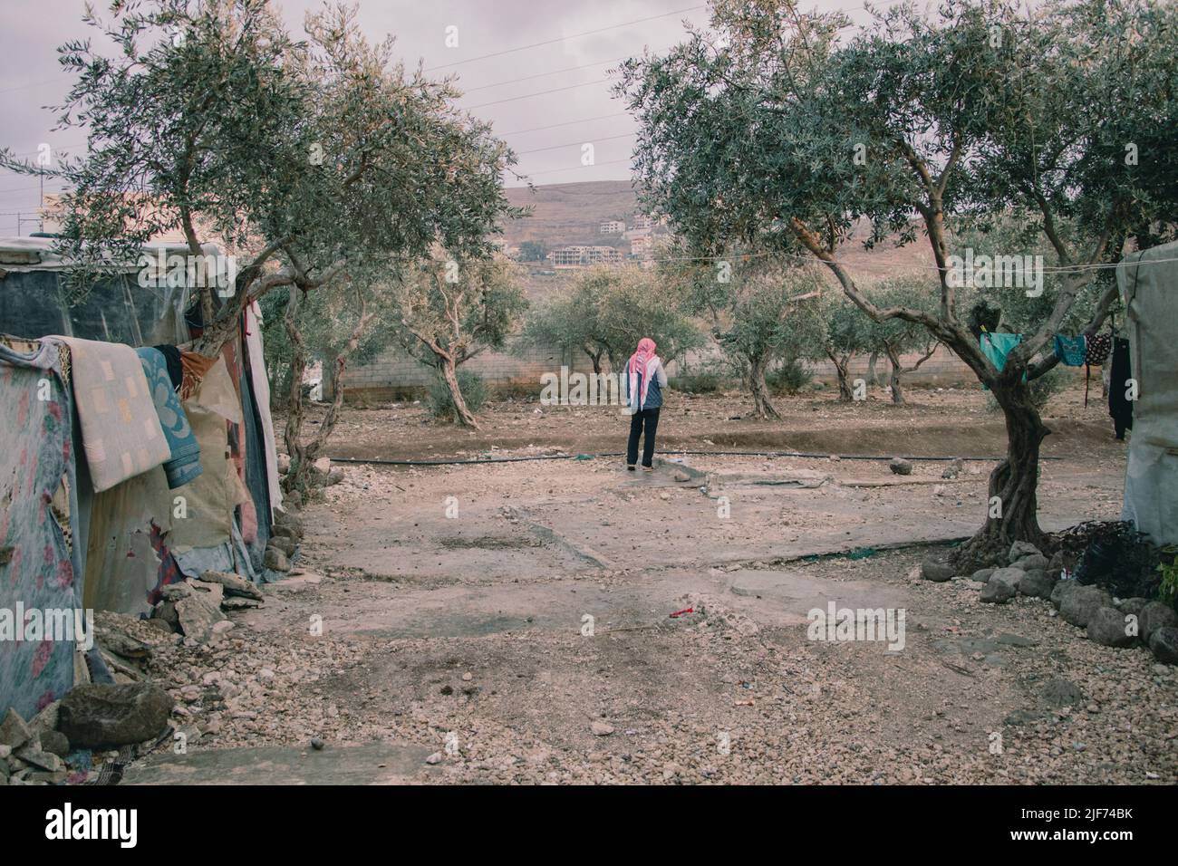 November 25, 2021, Halba, Akkar, Lebanon: Syrian man is walking around ...