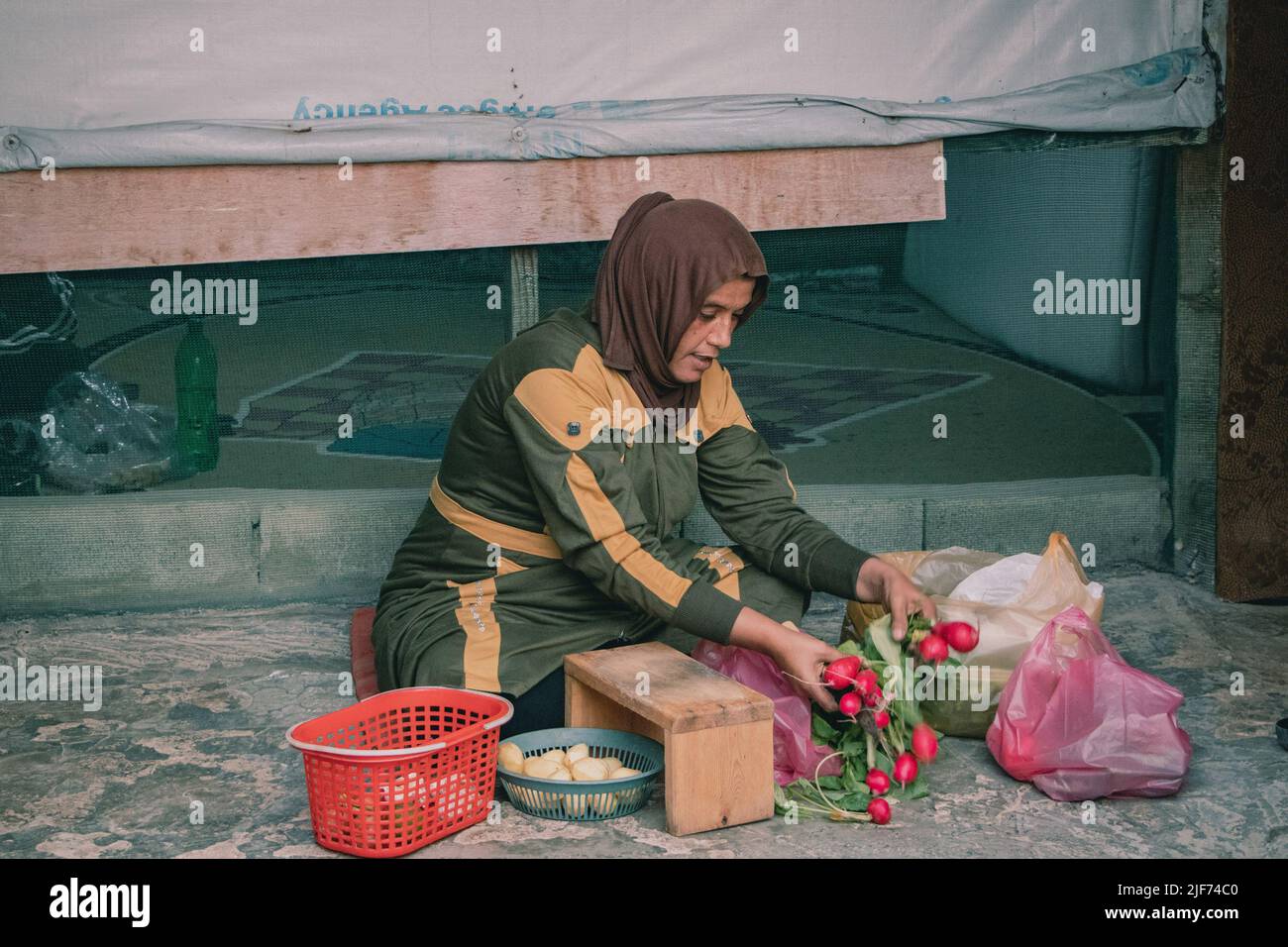 November 25, 2021, Halba, Akkar, Lebanon: Syrian woman prepares dinner ...